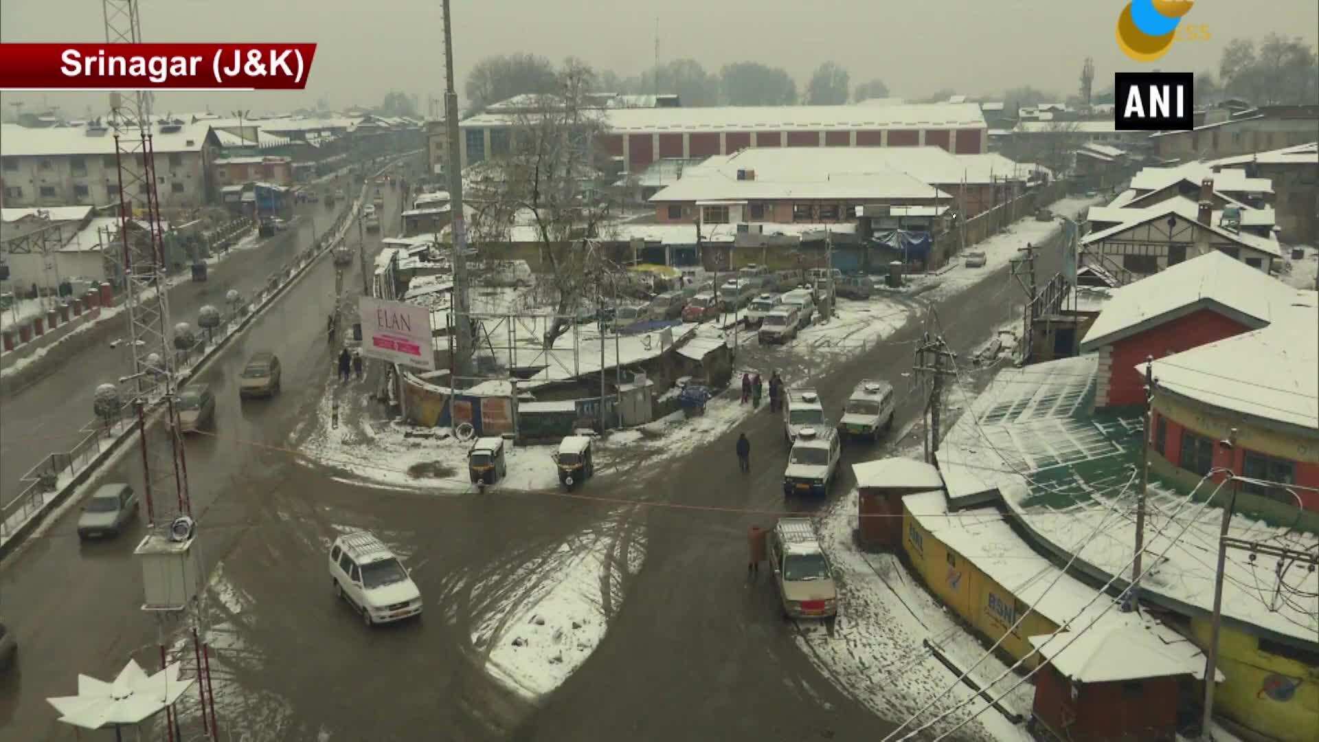 Srinagar shivers after receiving fresh snowfall | Zee Business