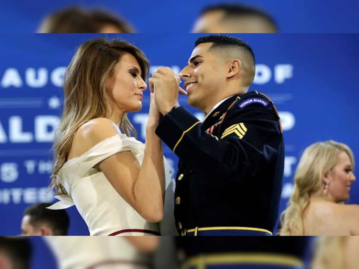 Melania Trump photo arm-in-arm with soldier under umbrella goes viral ...