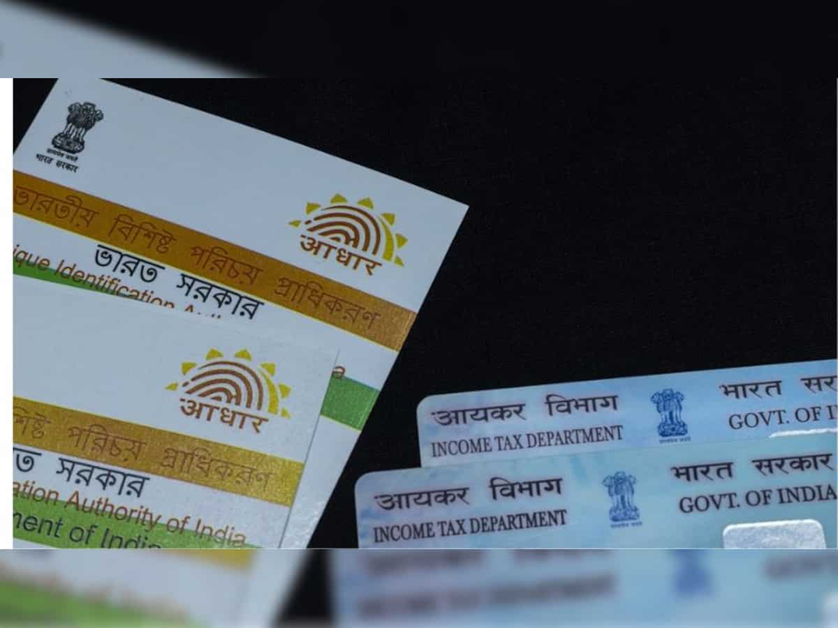 How to check Aadhaar PAN link status by SMS | Zee Business