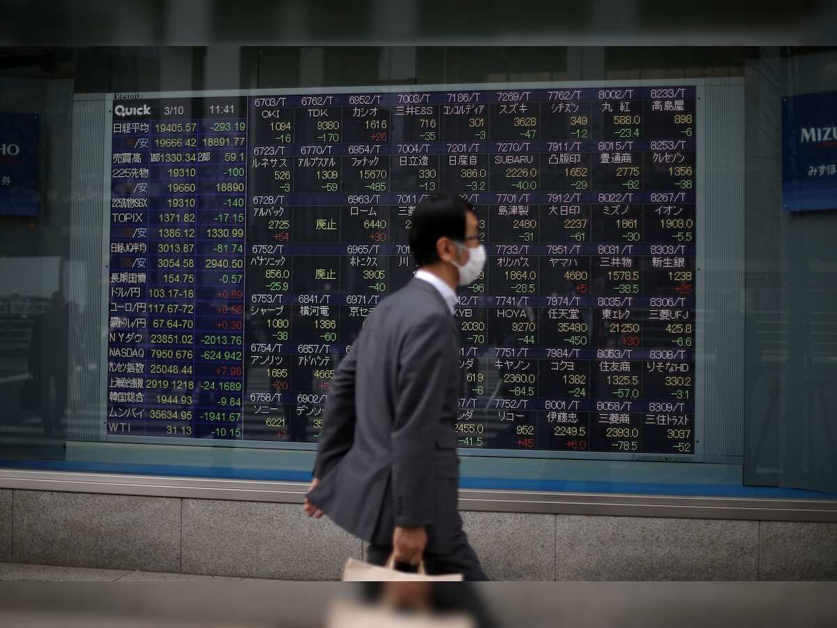 Asian stock markets trim losses as China beats GDP forecasts | Zee Business