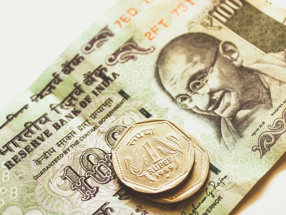 Rupee opens weaker at Rs 87.97 against dollar after US Fed rate cut ...